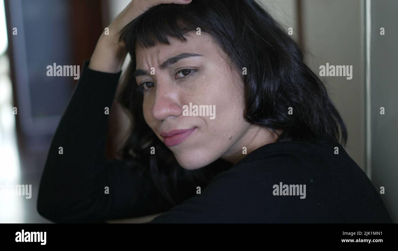 Closeup of young woman face feeling regret. Person taking deep breath ...