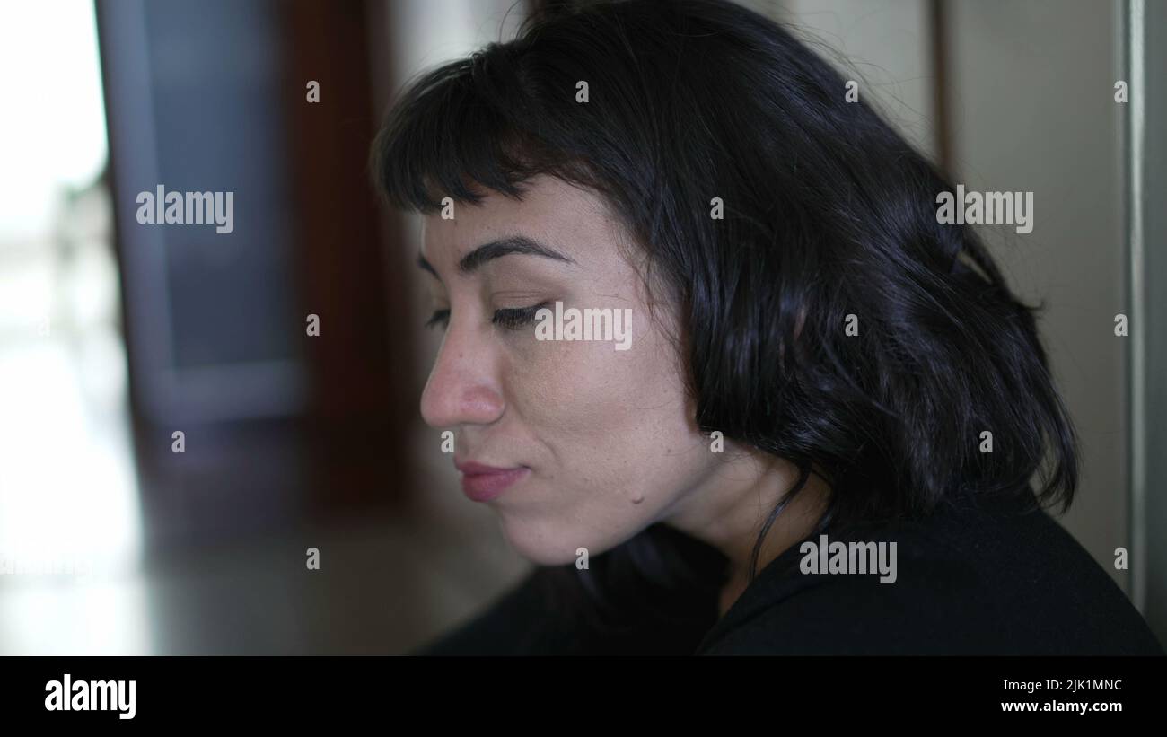 Closeup of young woman face feeling regret. Person taking deep breath ...