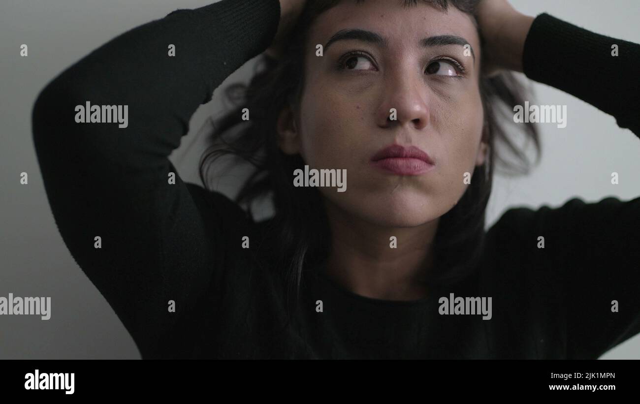 Close up woman face with frustrated emotion pondering solution to ...