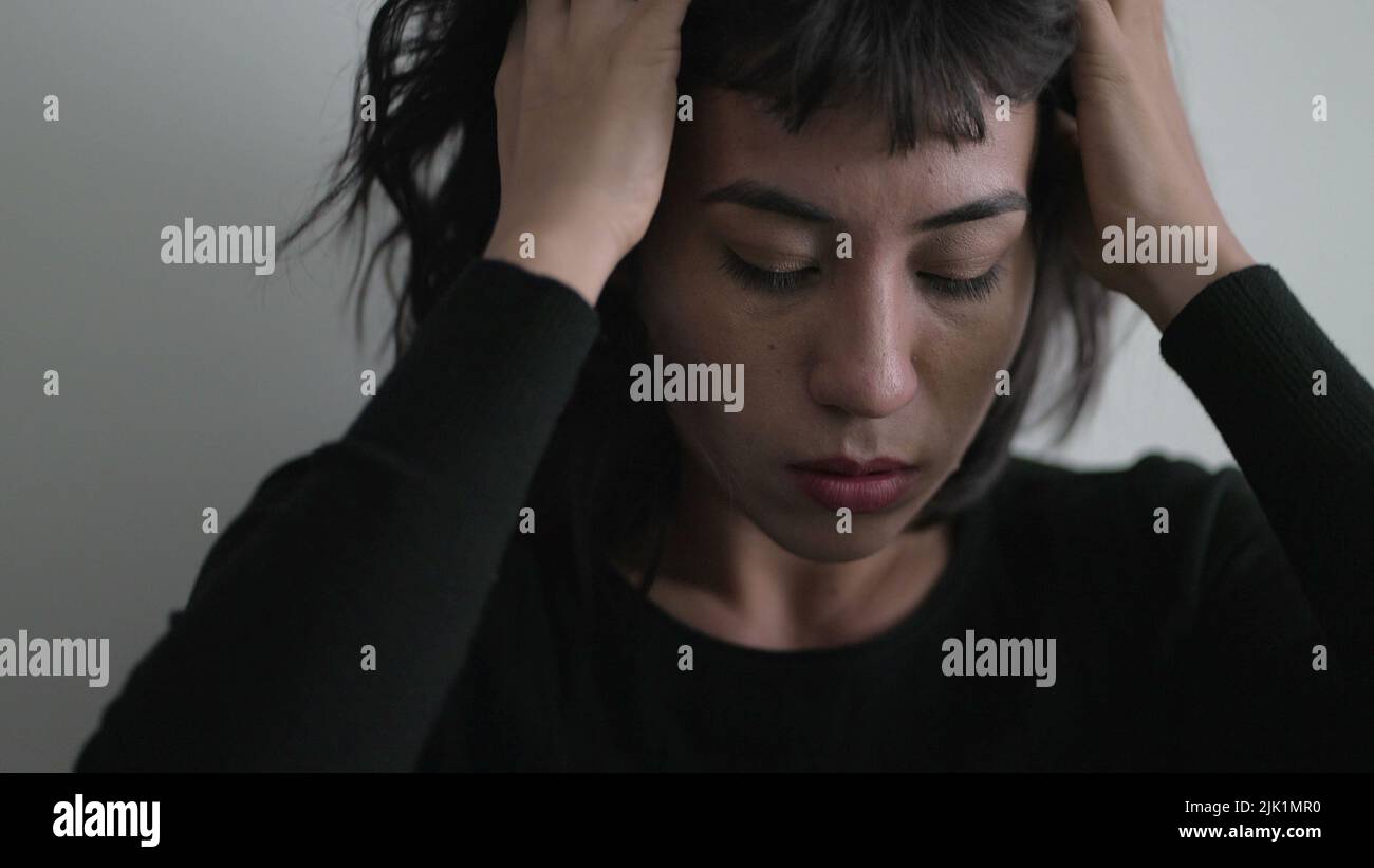 Close up woman face with frustrated emotion pondering solution to ...