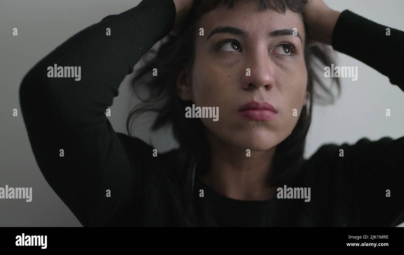 Close up woman face with frustrated emotion pondering solution to ...