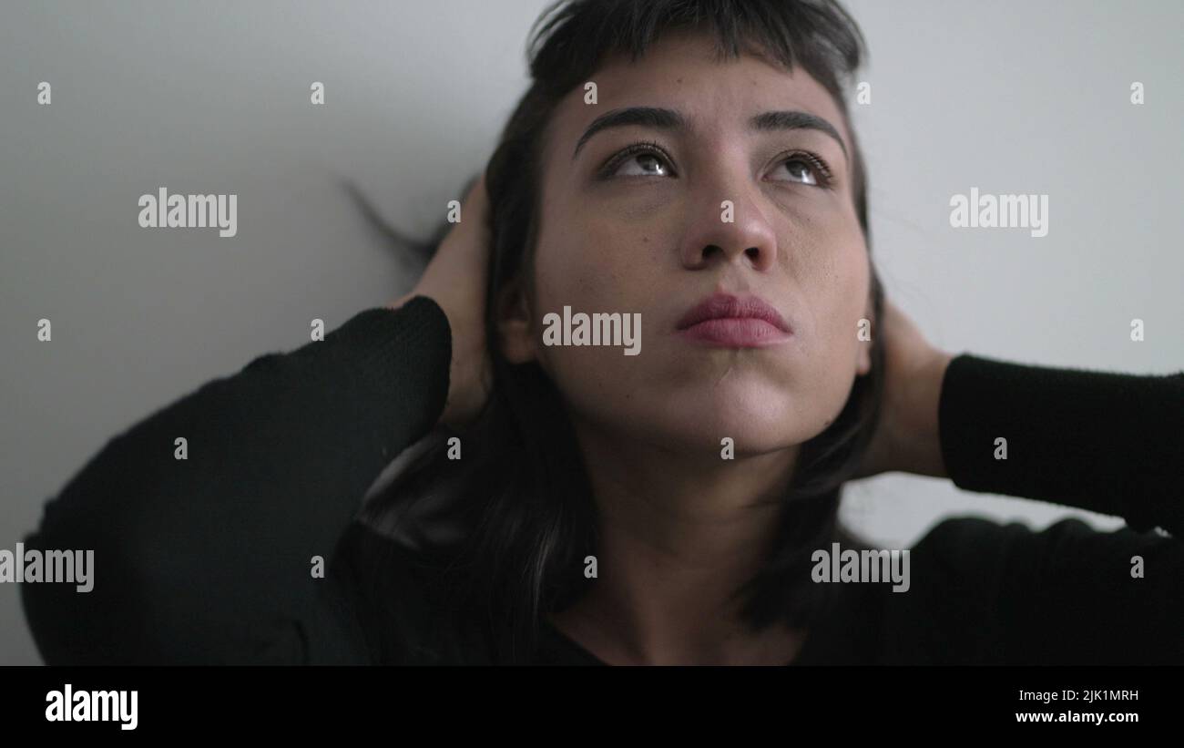 Close up woman face with frustrated emotion pondering solution to ...