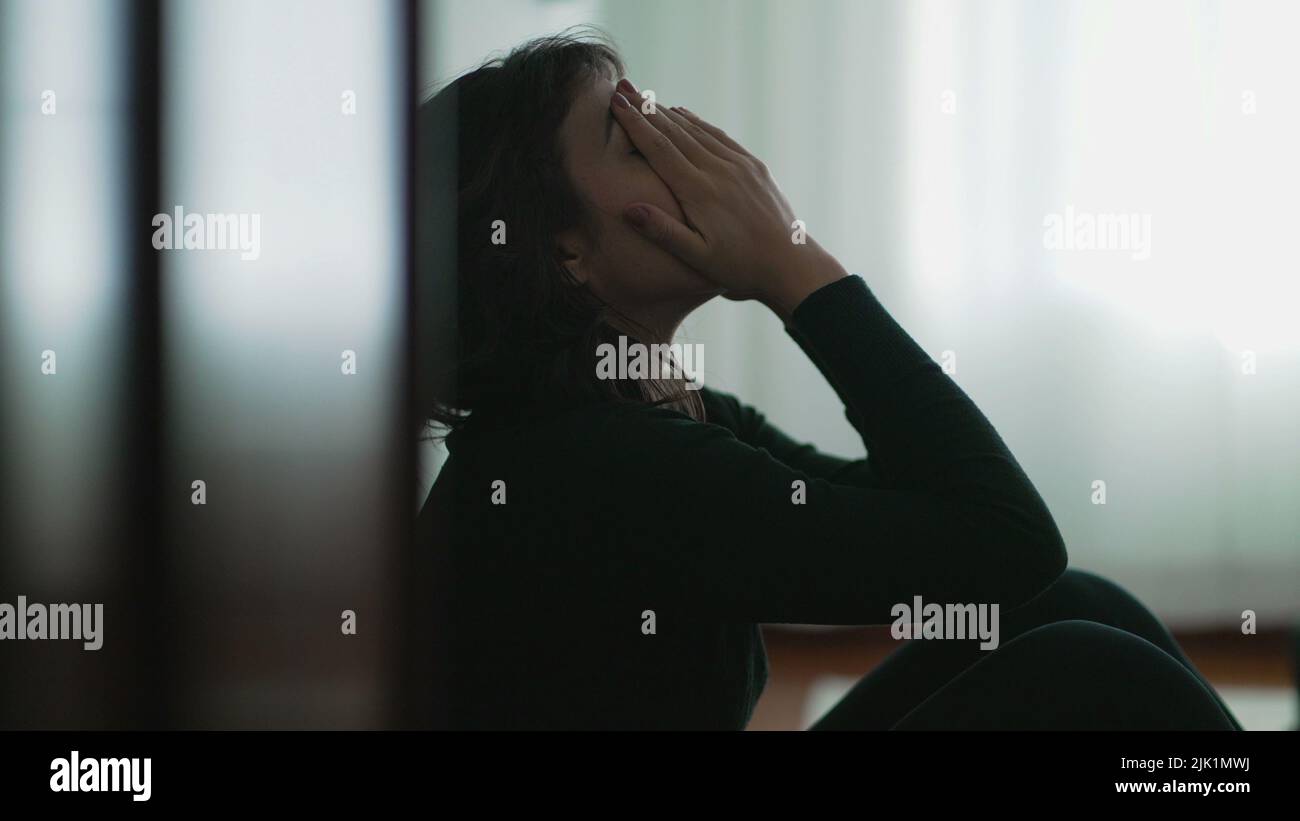 Sitting hands covering face crying sadness hi-res stock photography and ...
