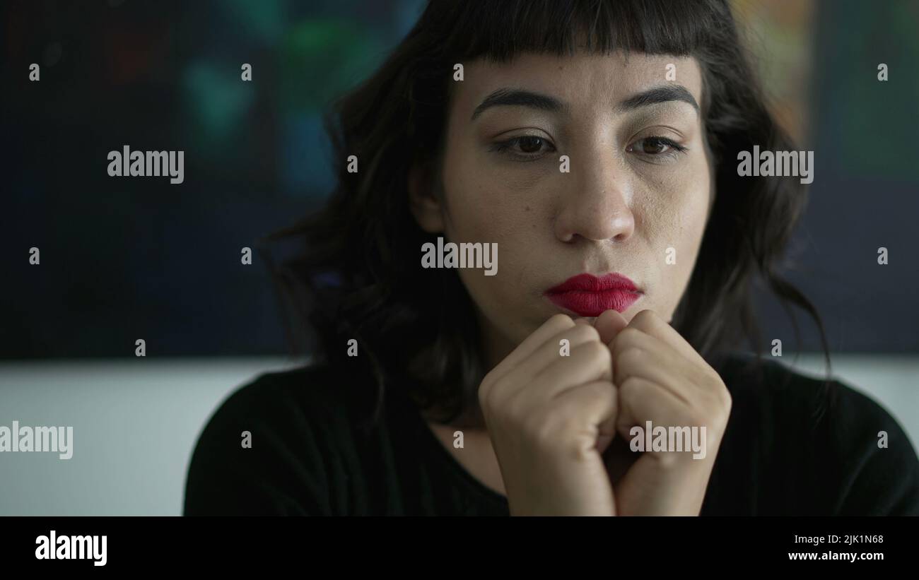 One anxious hispanic young woman closeup face. Portrait of person ...