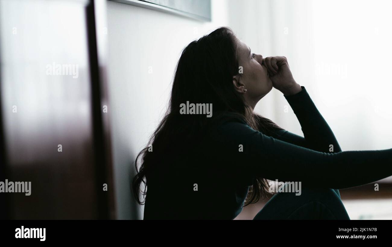 One desperate person suffering alone covering face with shame sitting ...