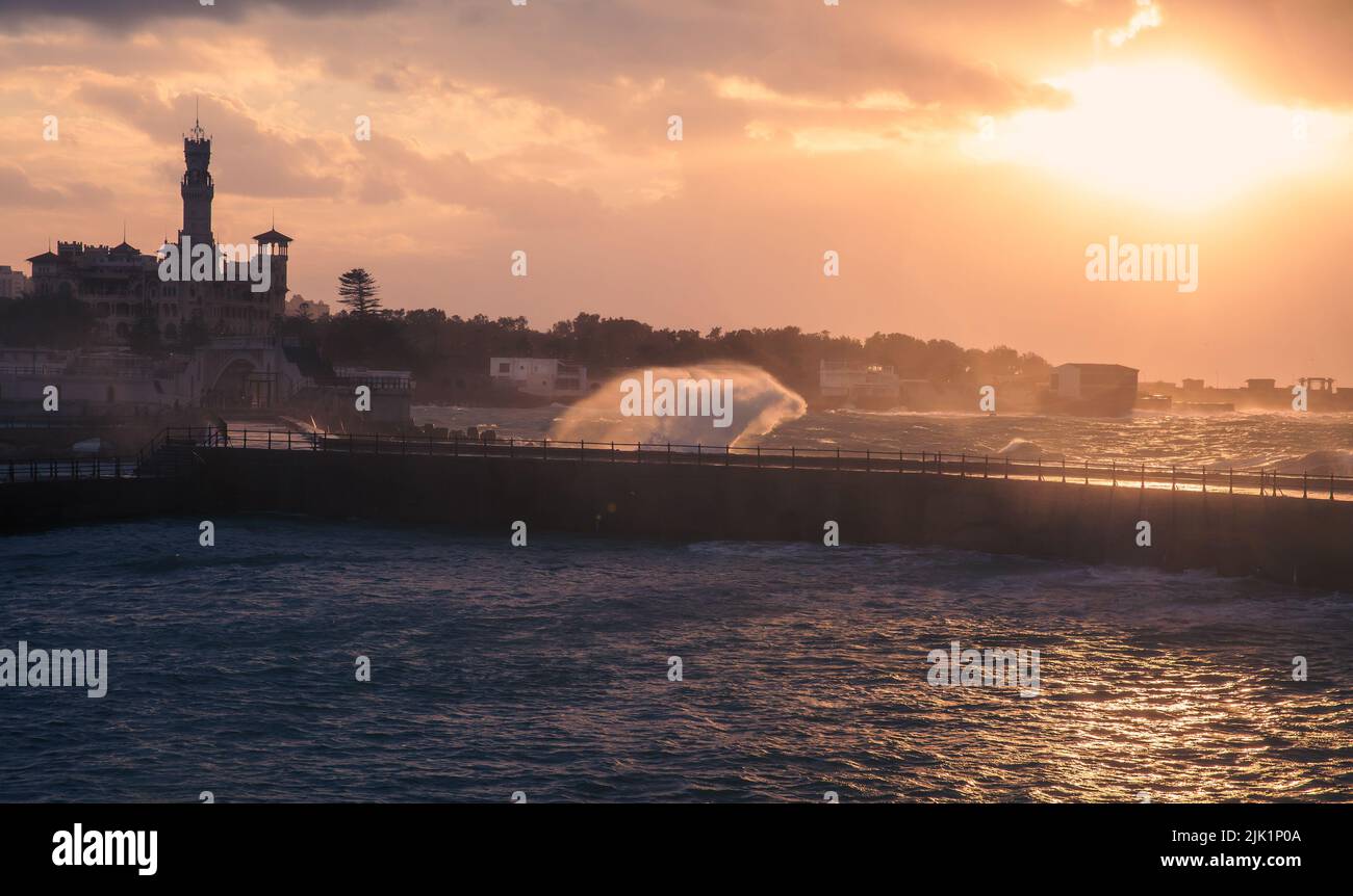 Montazah beach evening landscape with sunlight and breaking waves under ...