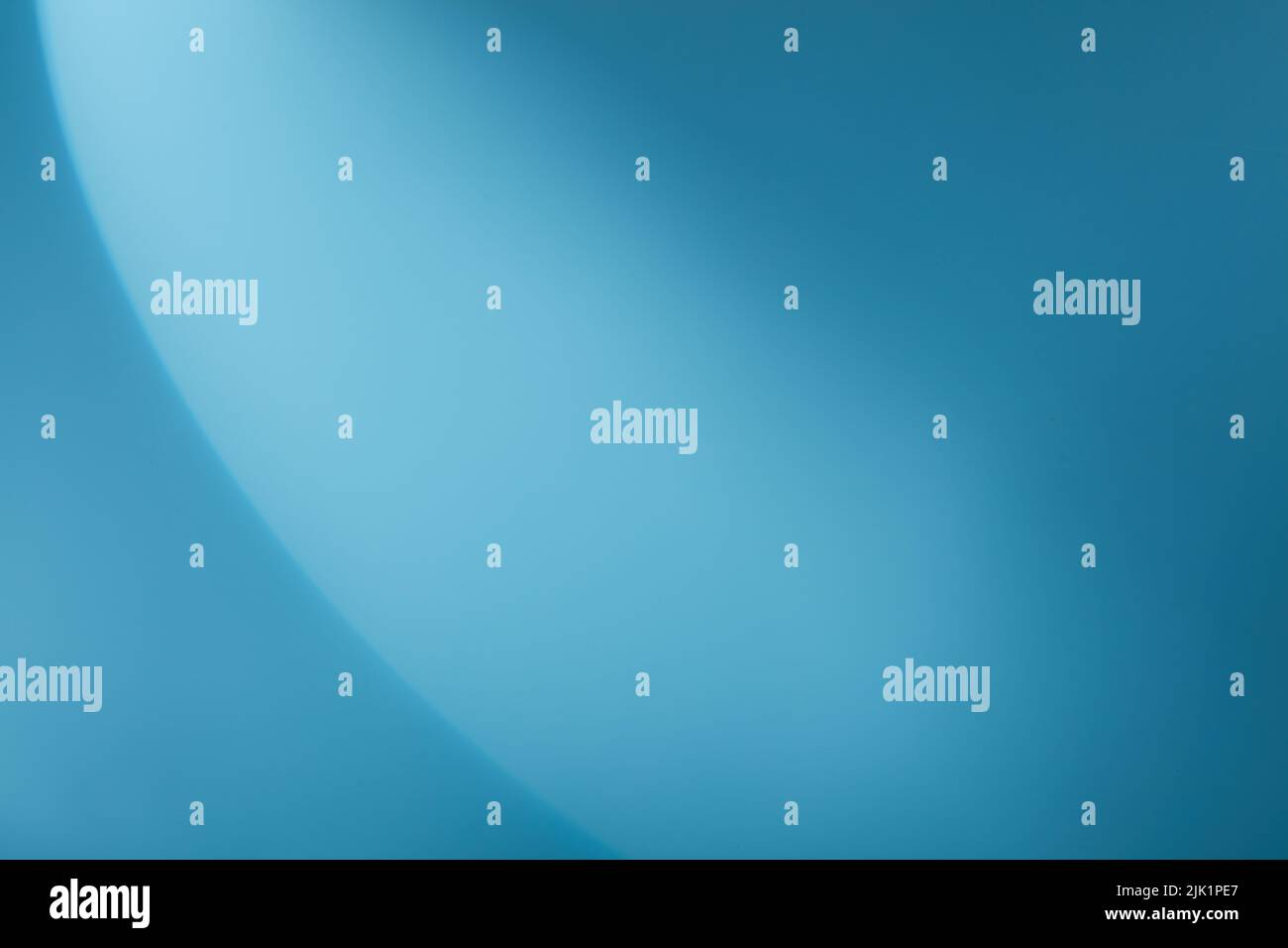 A semicircle of lights hits a light blue background Stock Photo - Alamy