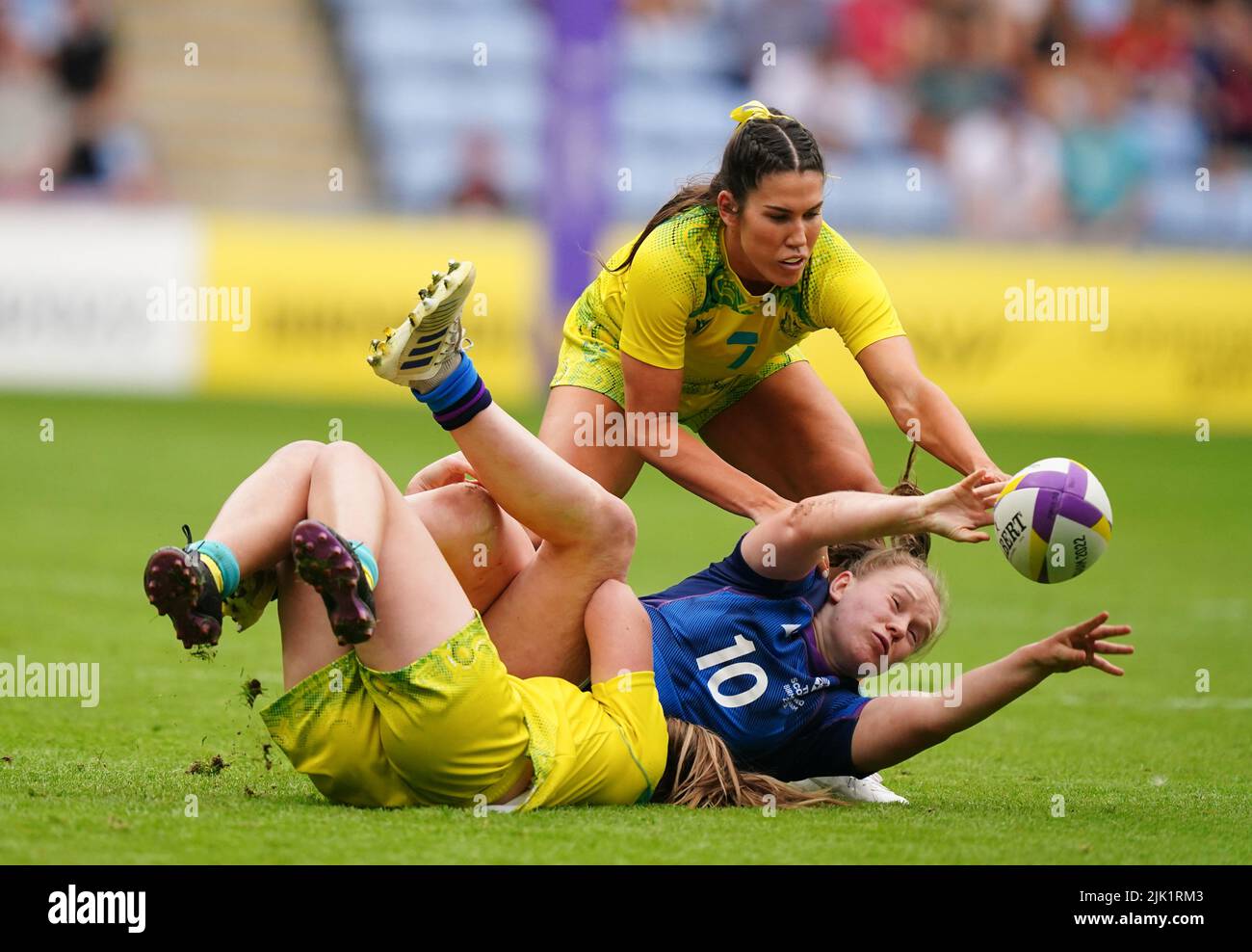 Scotland's Meryl Smith is tackled by Australia's Tia Hinds and Madison ...