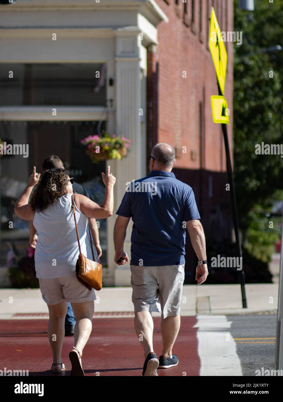 Lady crossing street hi-res stock photography and images - Alamy