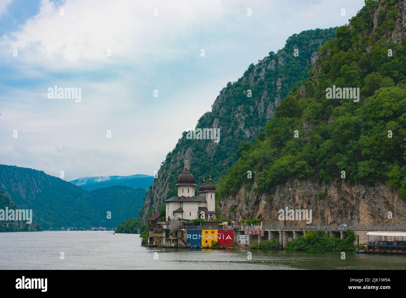 The Danube River narrows. You see the old church and monastery on the ...