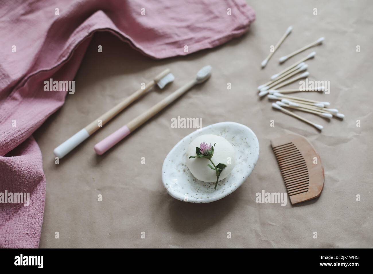 Soap bar, bamboo toothbrush and towel top view. Accessories for ...