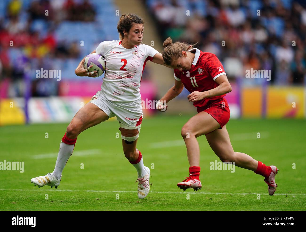 England's Abbie Brown is tackled by Canada's Piper Logan at Coventry ...