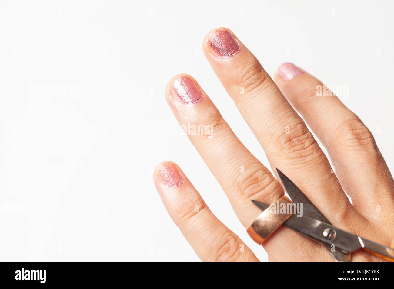 woman's hand cuts an engagement ring with scissors Stock Photo - Alamy