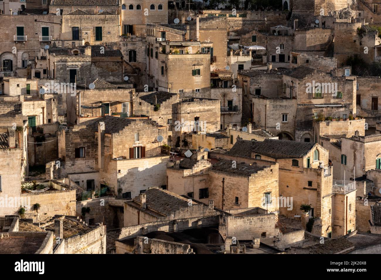 Residential cave houses in historic downtown Matera, Italy Stock Photo ...
