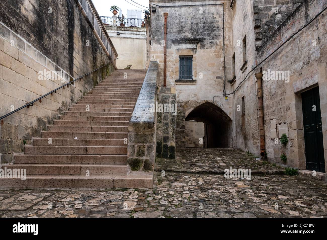 Ancient medieval alleyway somewhere in the historic town of Matera ...