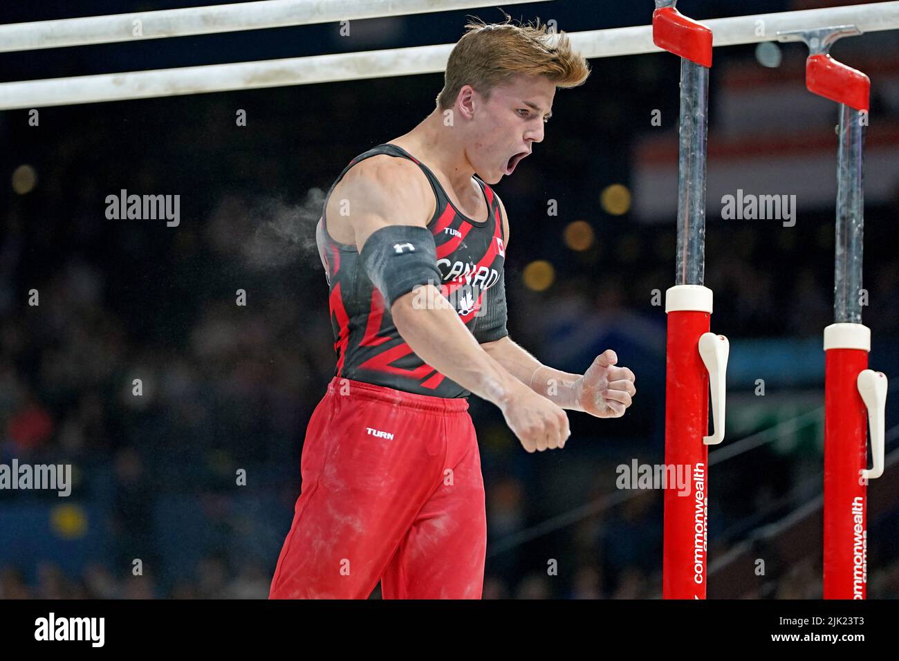 Canada's Felix Dolic celebrates after his parallel bars rotation of the ...