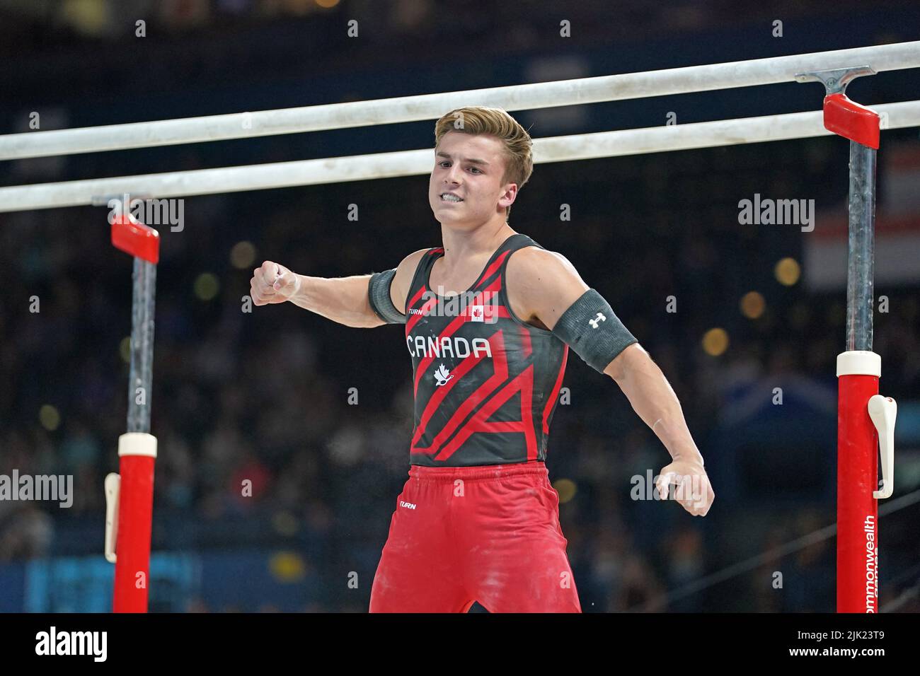 Canada's Felix Dolic celebrates after his parallel bars rotation of the ...