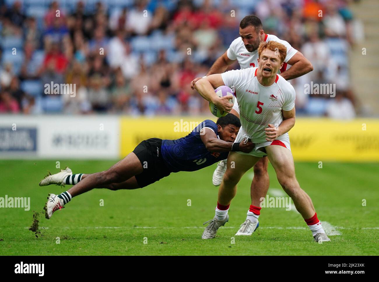 England's Blake Boyland is tackle by Sri Lanka's Reeza Raffaideen at ...