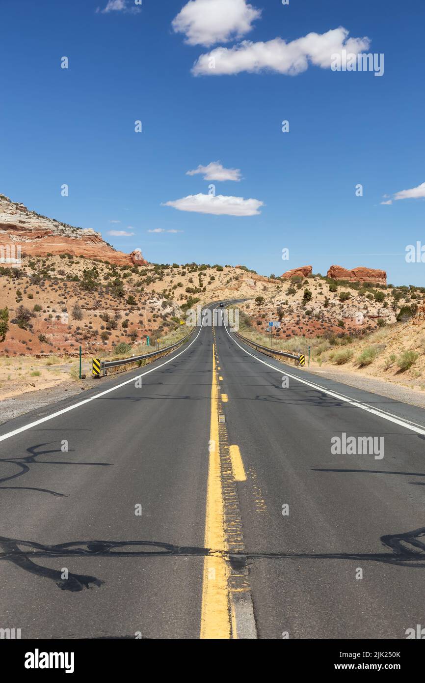 Scenic Road in the Dry Desert with Red Rocky Mountains in Background ...