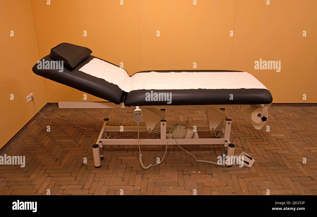 Examination room in a medical clinic, adjustable bed Stock Photo - Alamy
