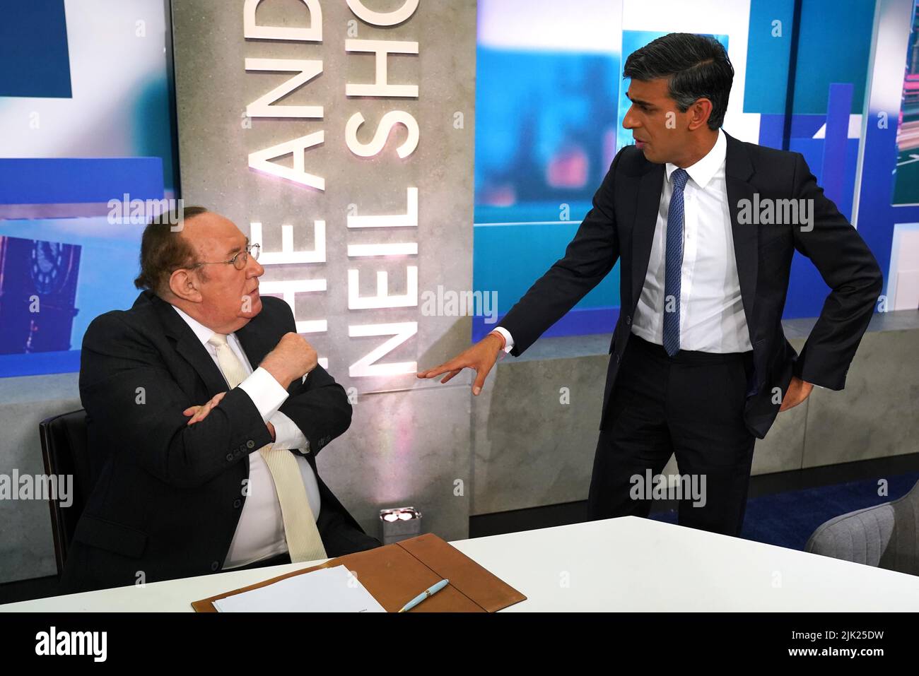 Andrew Neil (left) with Rishi Sunak before he appears on the Andrew ...