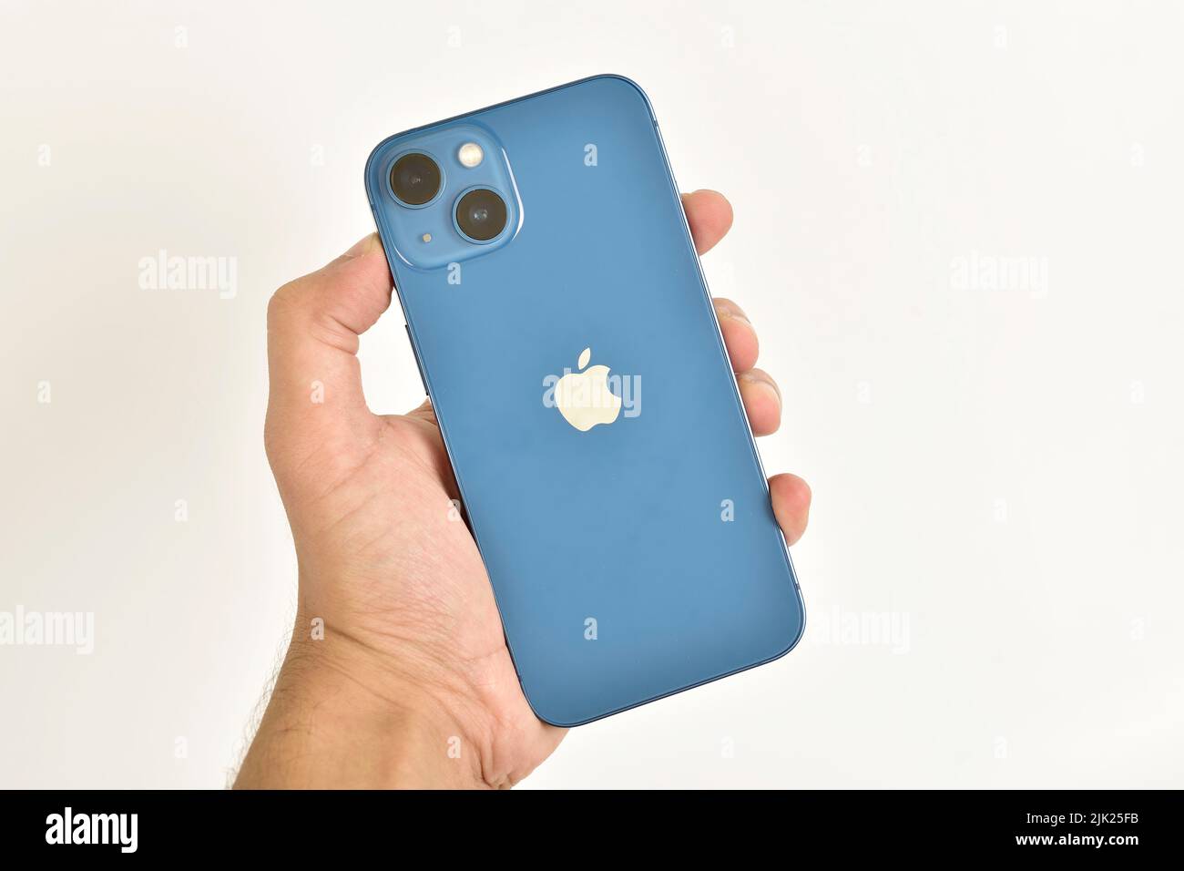 New Delhi, India - June 22, 2022: Apple iphone 13 blue in hand isolated ...