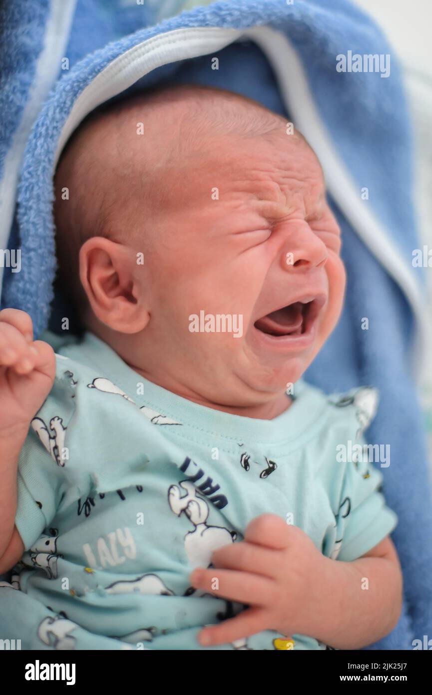Child crying parents hug hi-res stock photography and images - Alamy