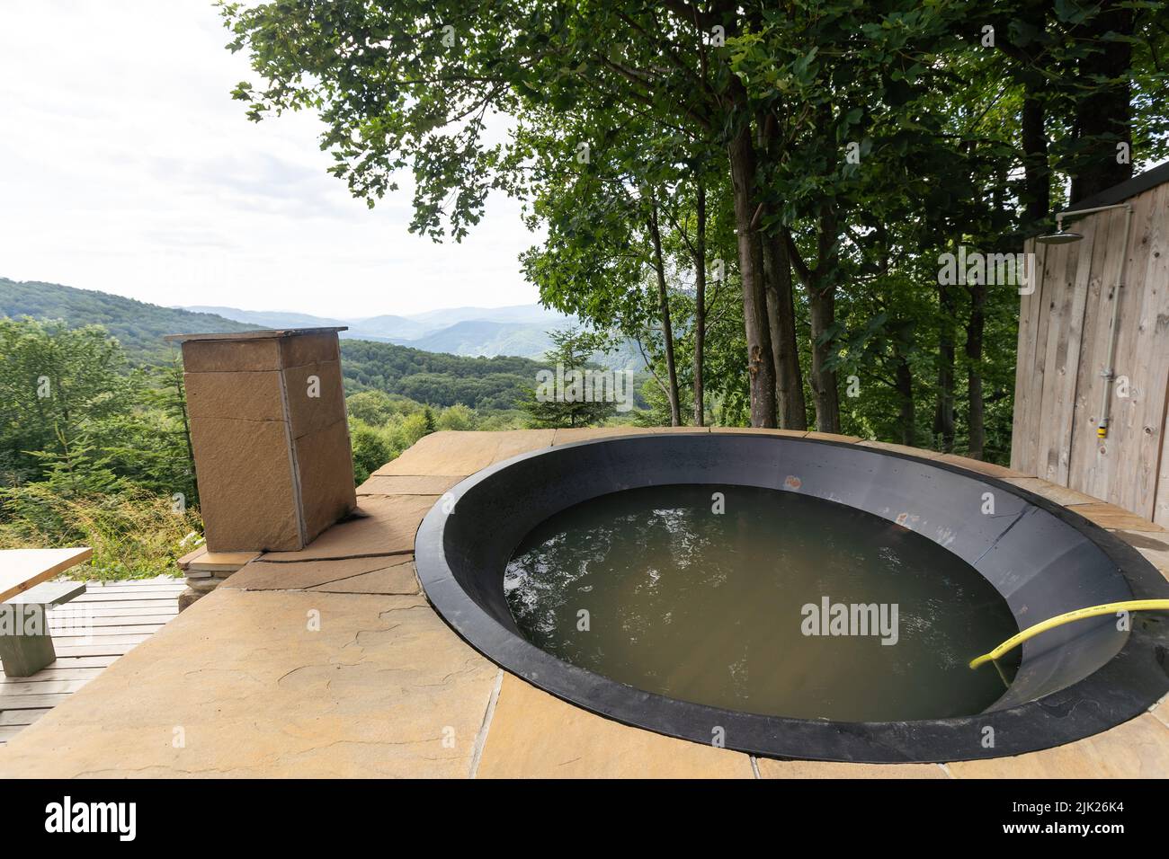Wooden hot vat on terrace at mountains. vacation concept with hot bath ...