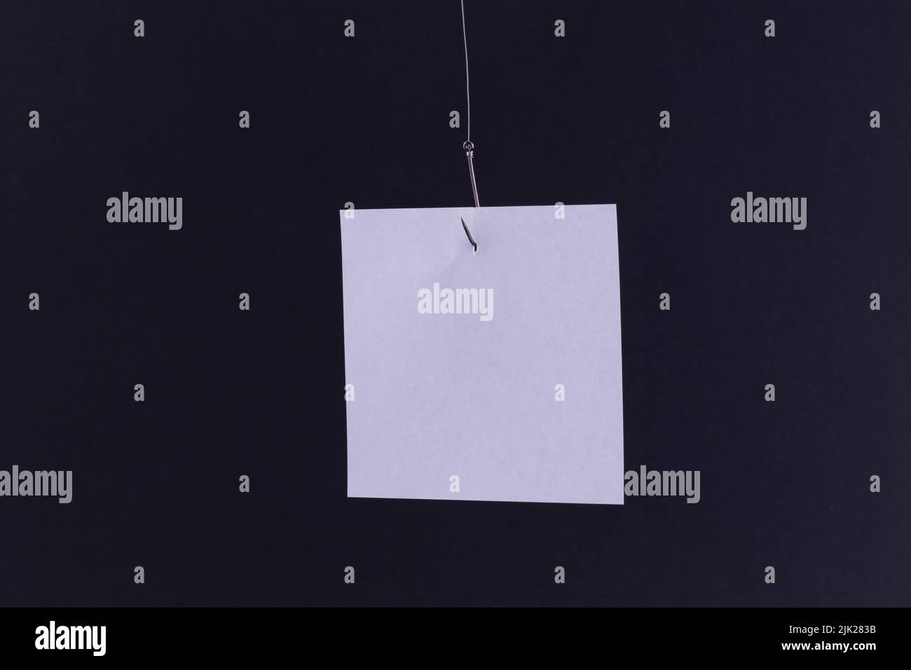 Mockup of a Blank White Memo Paper with Copy Space Hanging on a Fishing ...