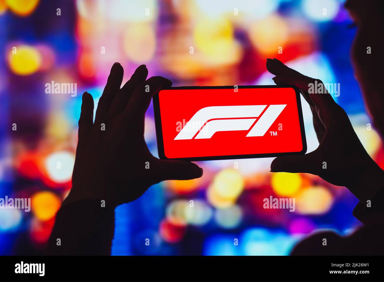 In this photo illustration, the Formula One logo is displayed on a ...