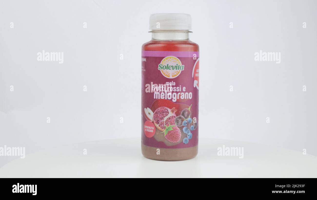 Rome, Italy - June 20, 2022: a glass jar of natural juice rotating on a ...