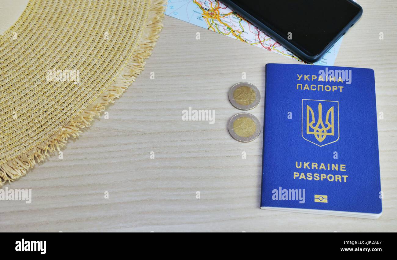 blue Ukrainian passport on the world map Stock Photo - Alamy