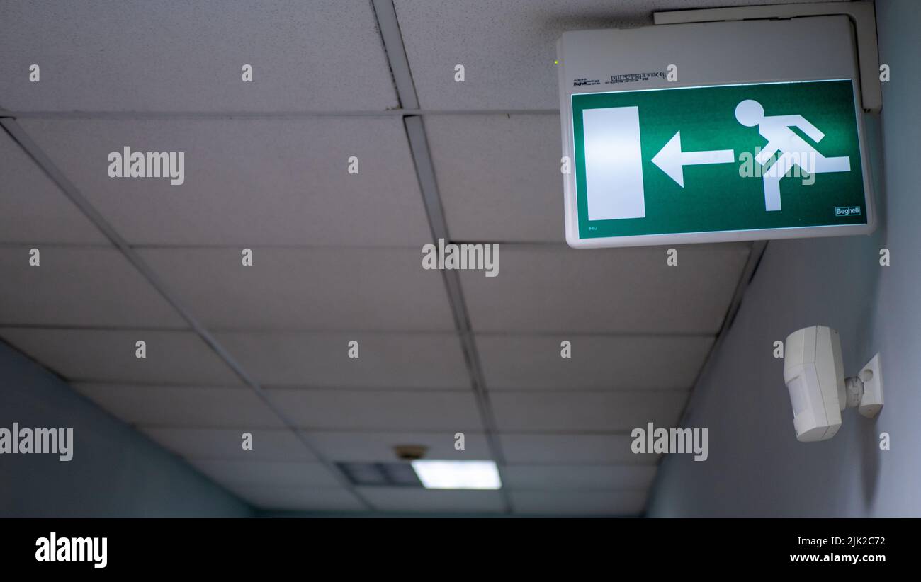 Fire exit sign in the corridor of the building Stock Photo - Alamy