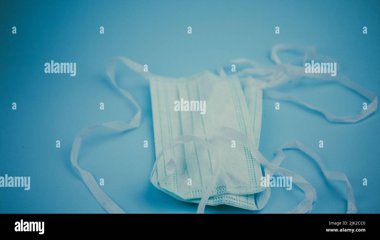 medical mask, close up, on blue background Stock Photo - Alamy