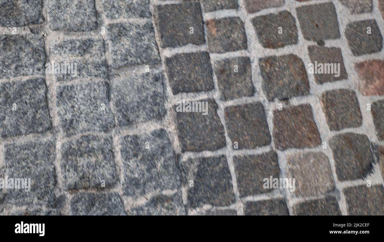 Top view on stone road close up. Old pavement of granite. Brown square ...
