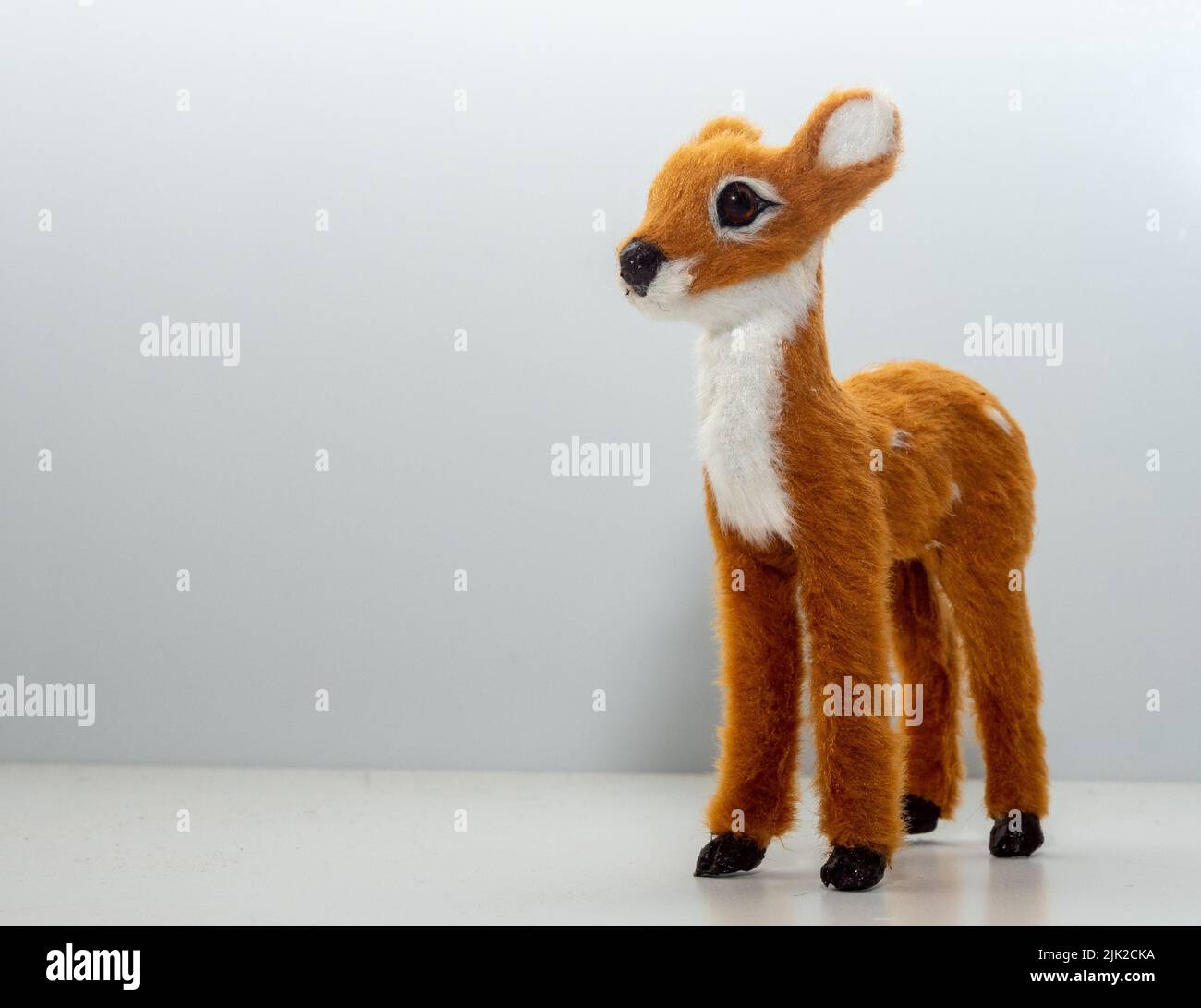 soft toy deer on a white background Stock Photo - Alamy