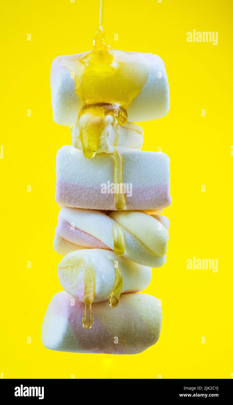 twisted marshmallows placed on top of each other sprinkled with honey ...