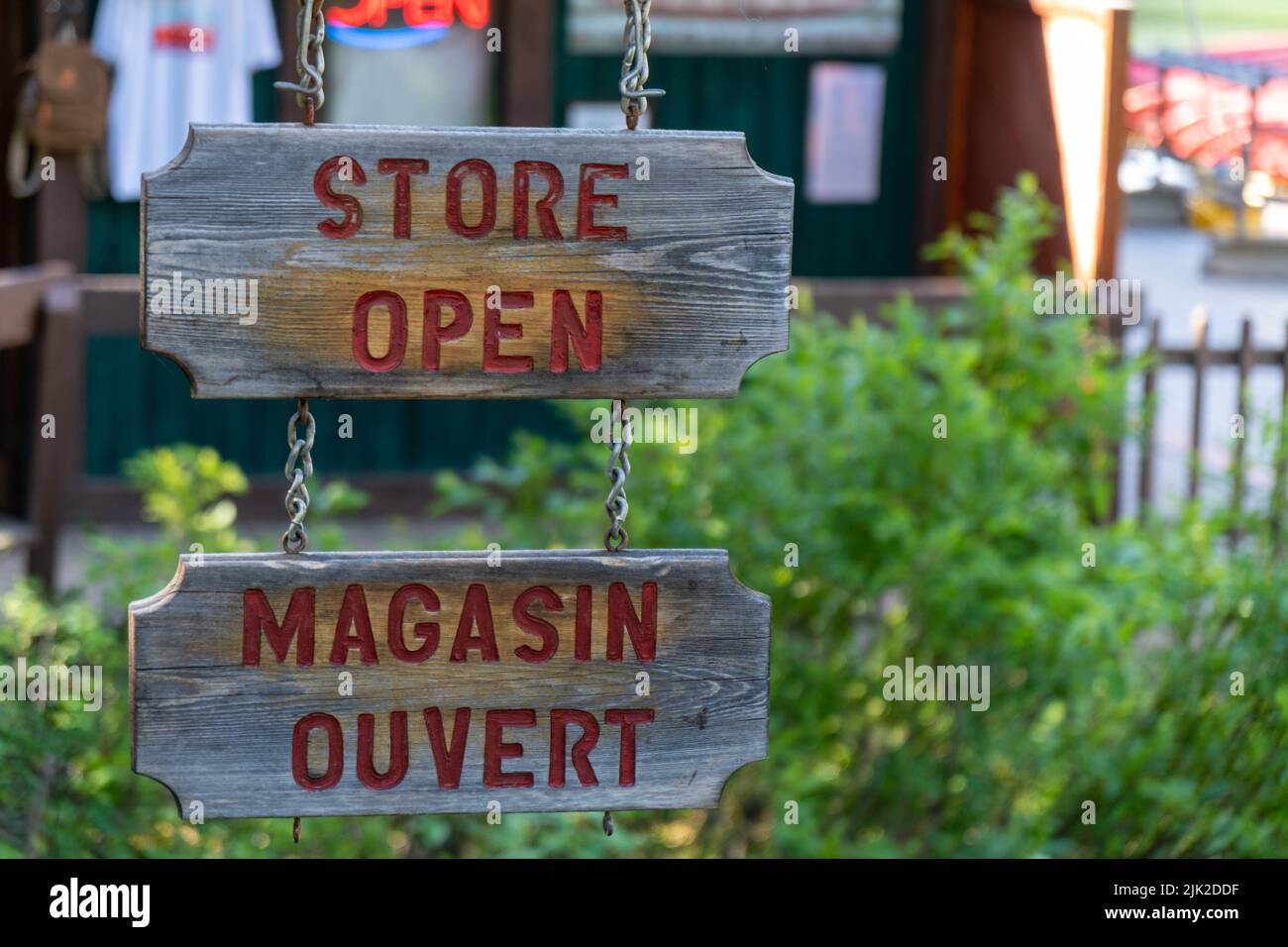 Wooden sign for Store Open at a gift shop, also in French Stock Photo ...