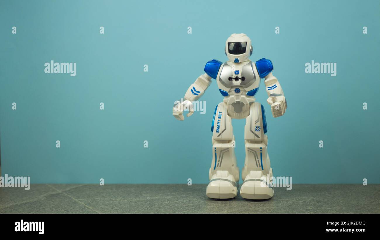 white with blue robot stickers on blue background Stock Photo - Alamy