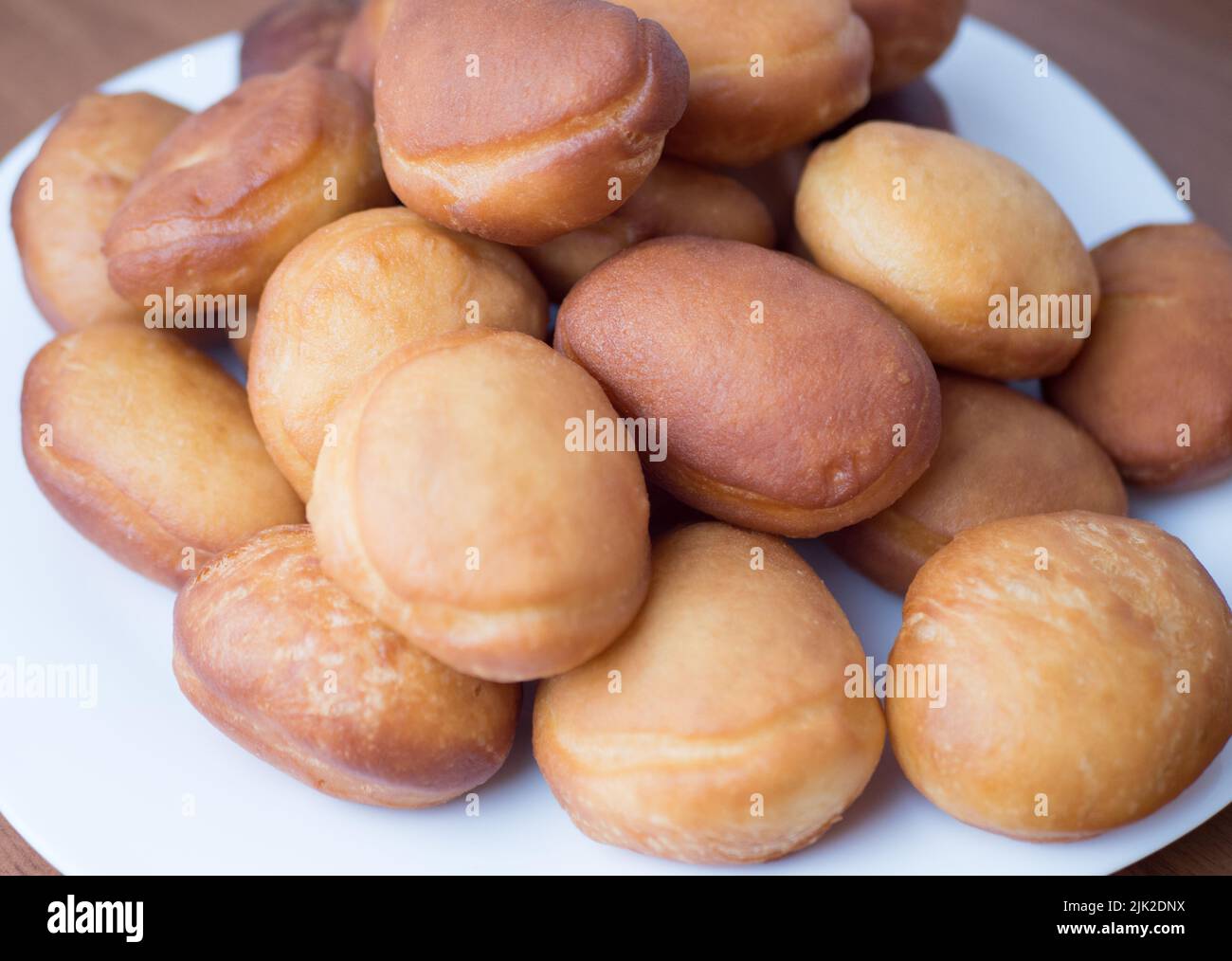 Delicious sweet donuts on a plate. close up. Traditional Jewish sweet ...