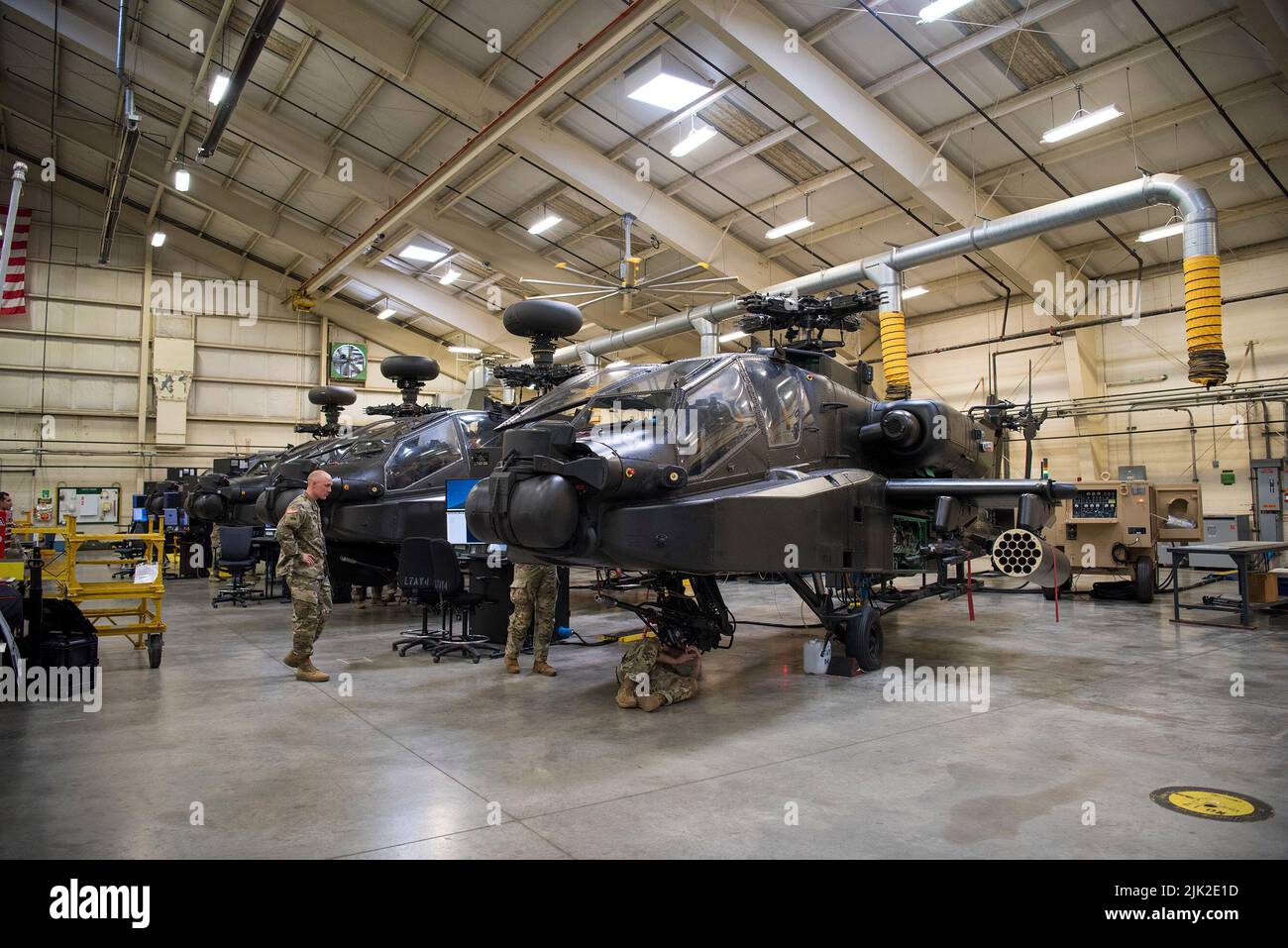 Instructors and students perform hands-on training with Boeing AH-64 ...