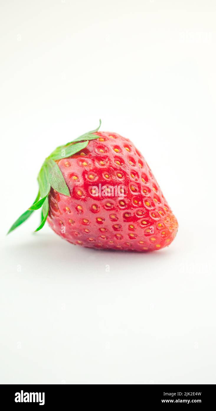 Red berry, one strawberry on white background Stock Photo - Alamy