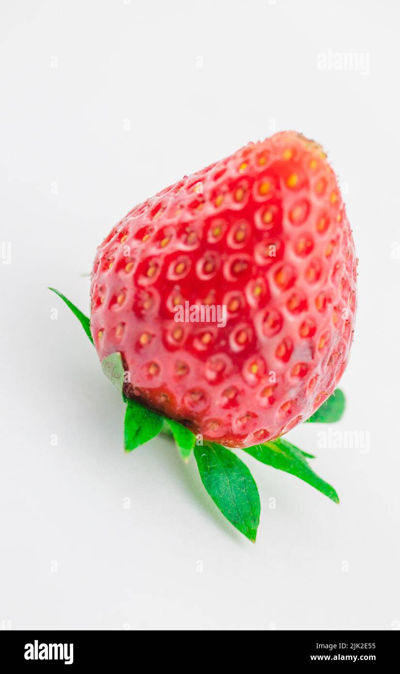 Red berry, one strawberry on white background Stock Photo - Alamy