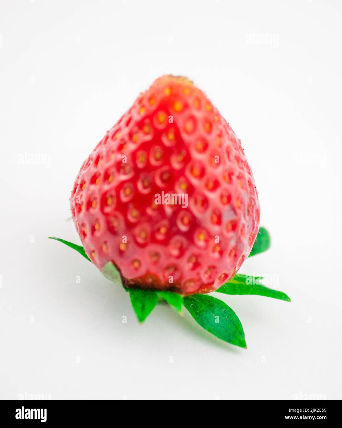 Red berry, one strawberry on white background Stock Photo - Alamy