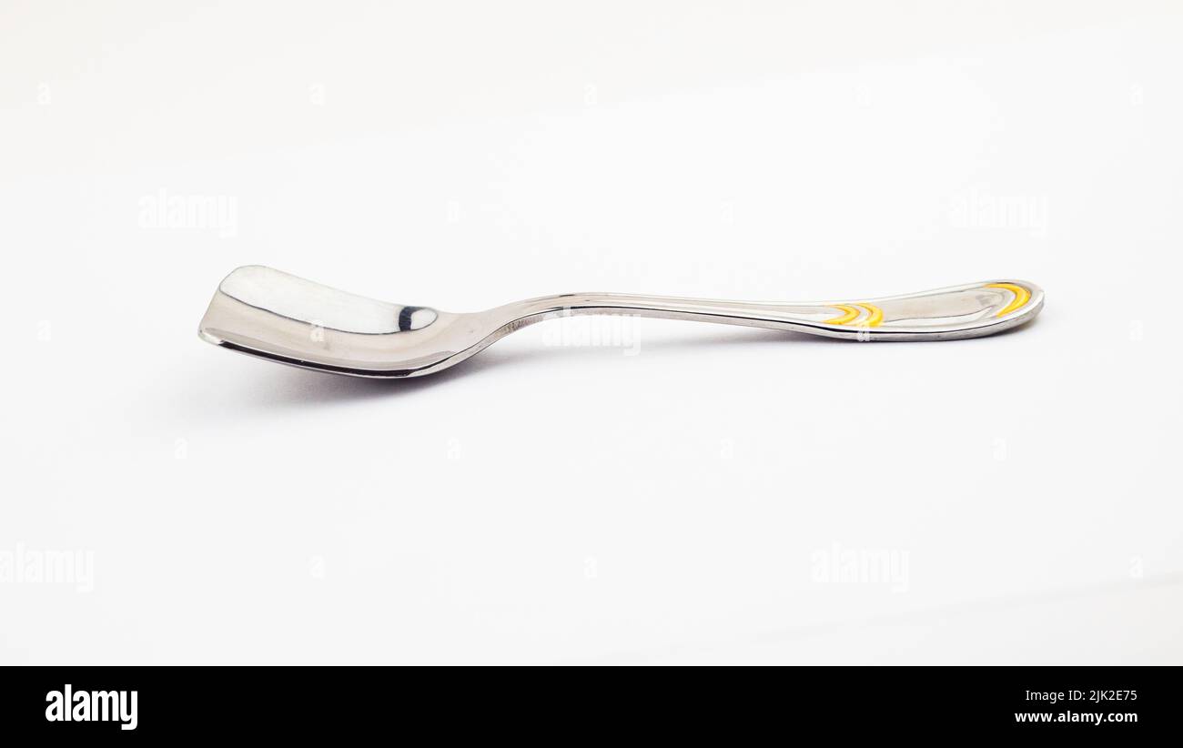 stainless steel teaspoon isolated on white background Stock Photo - Alamy