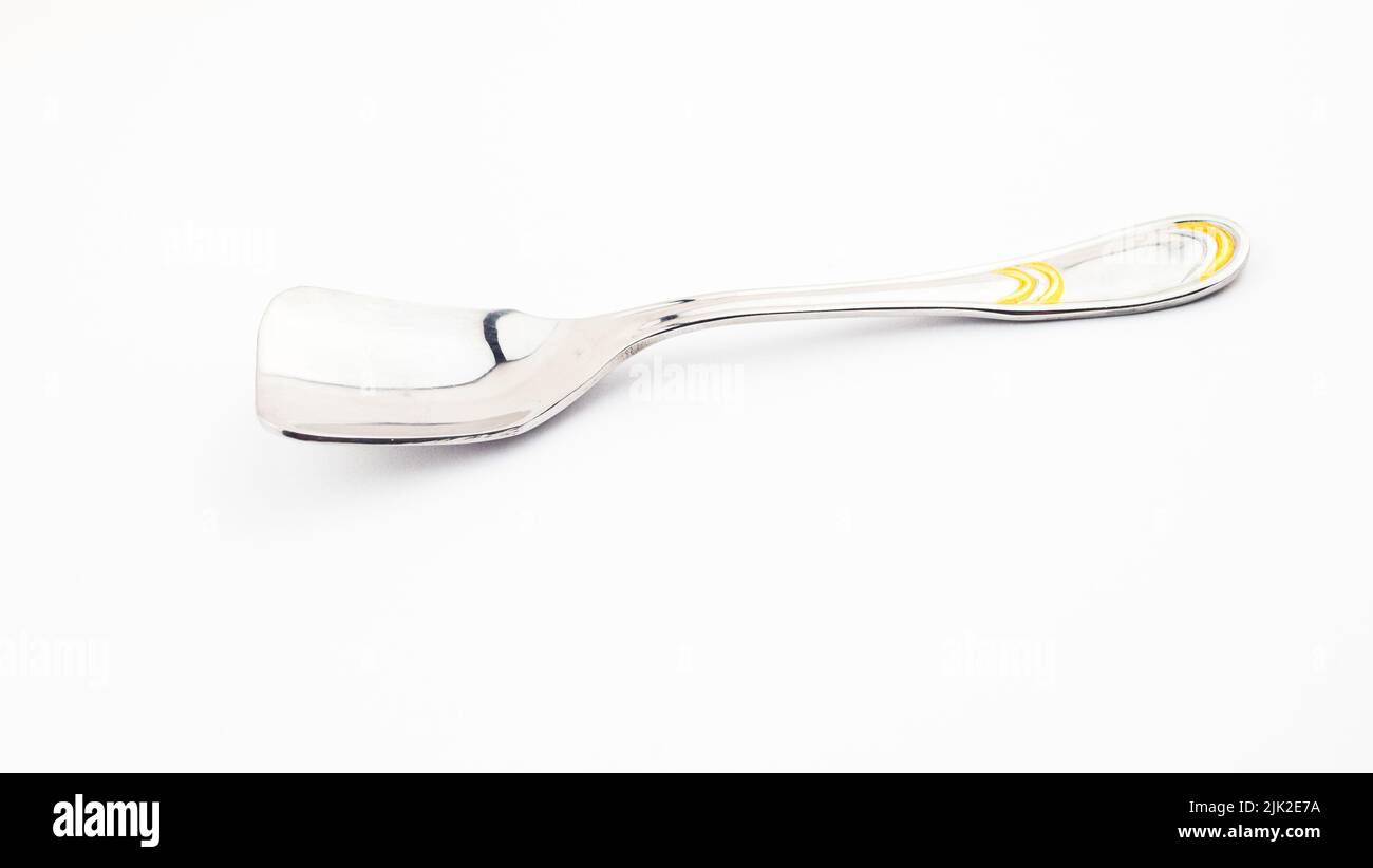 stainless steel teaspoon isolated on white background Stock Photo - Alamy