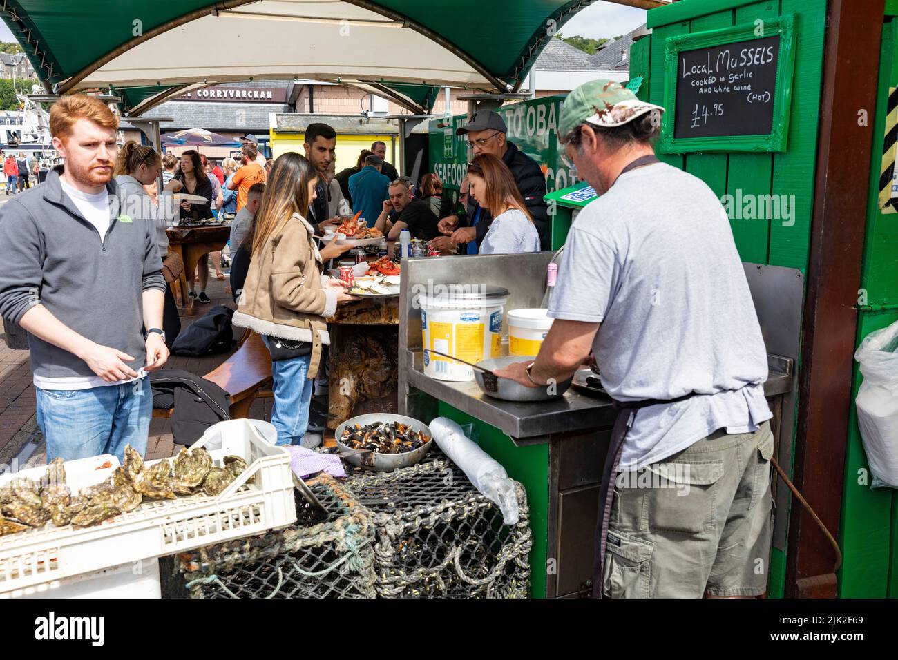 Seafood Hut green shack Oban pier and port in Scotland, chef cooking ...