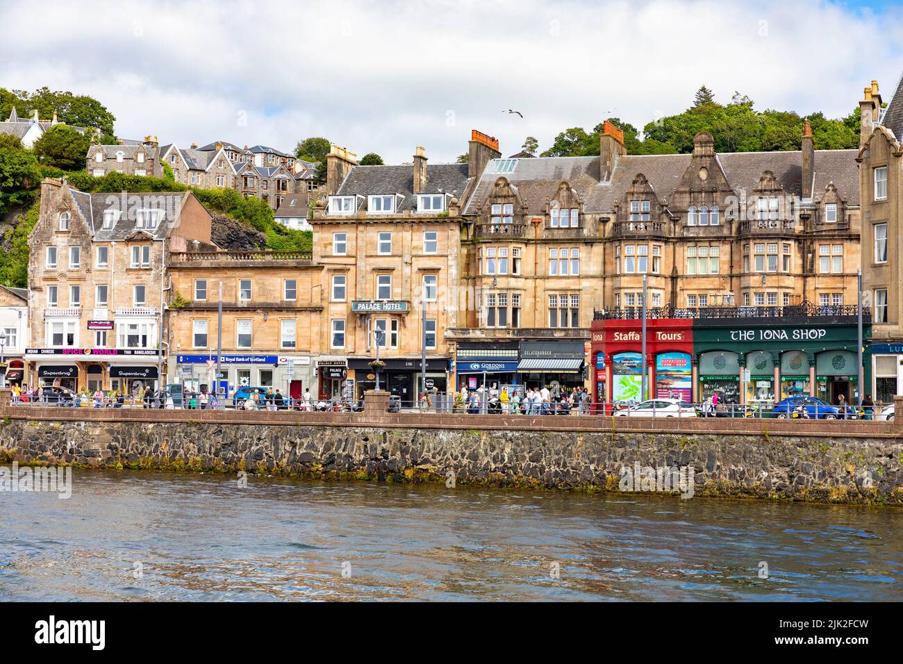 Oban town centre waterfront on sunny summers day, high street shops and ...