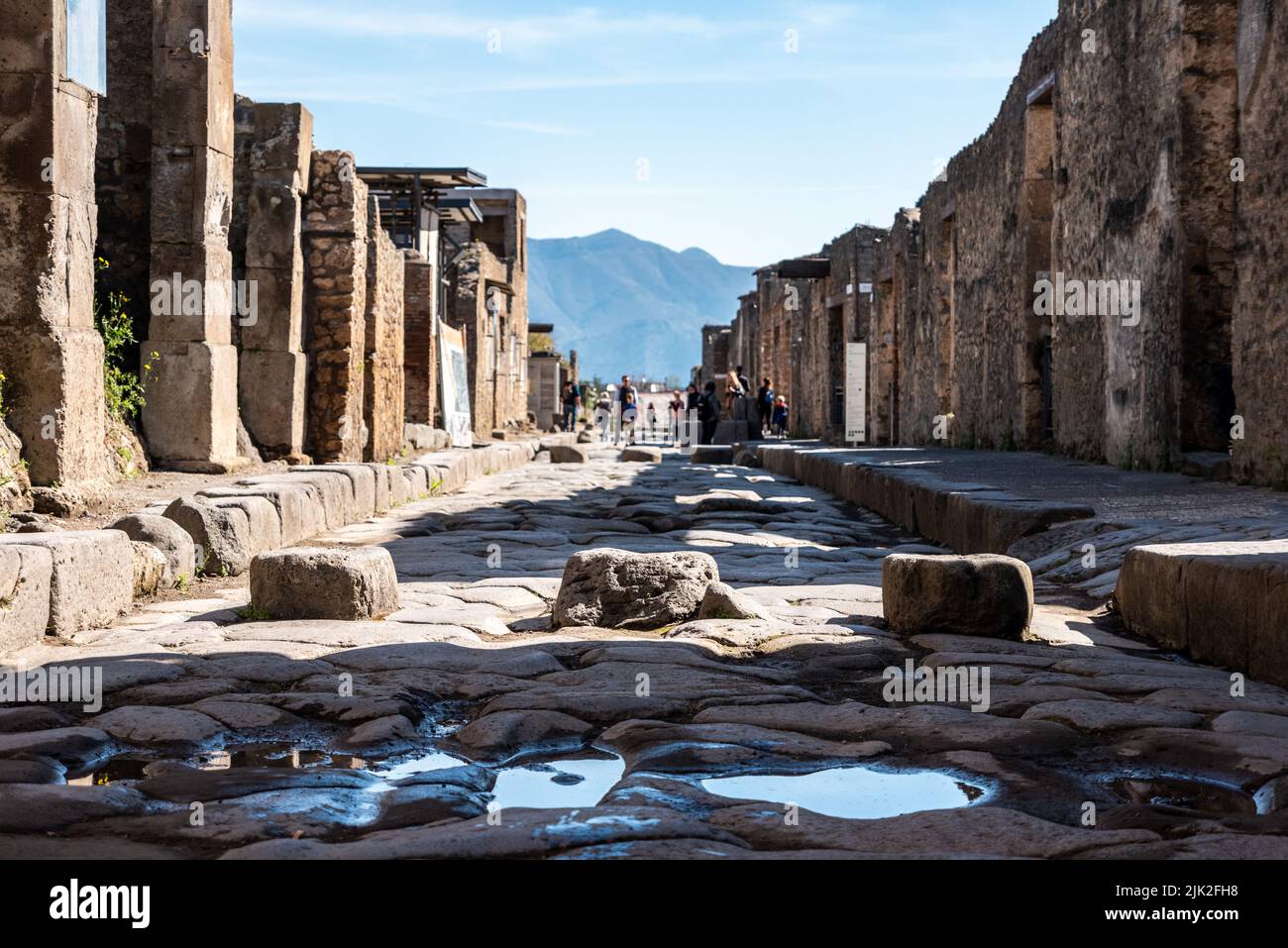 A crosswalk of a typical Roman road in the ancient city of Pompeii ...