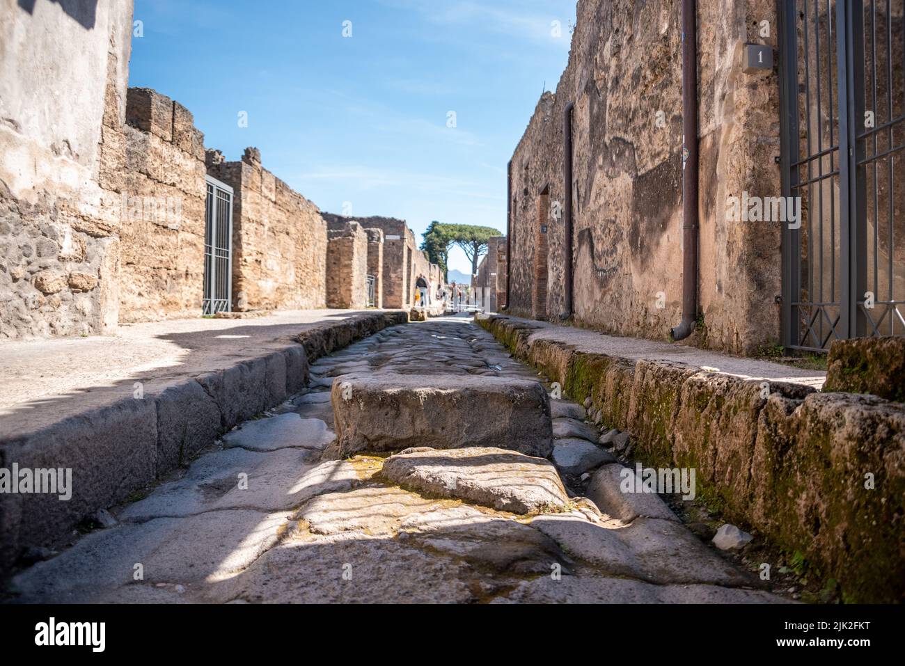 A crosswalk of a typical Roman road in the ancient city of Pompeii ...